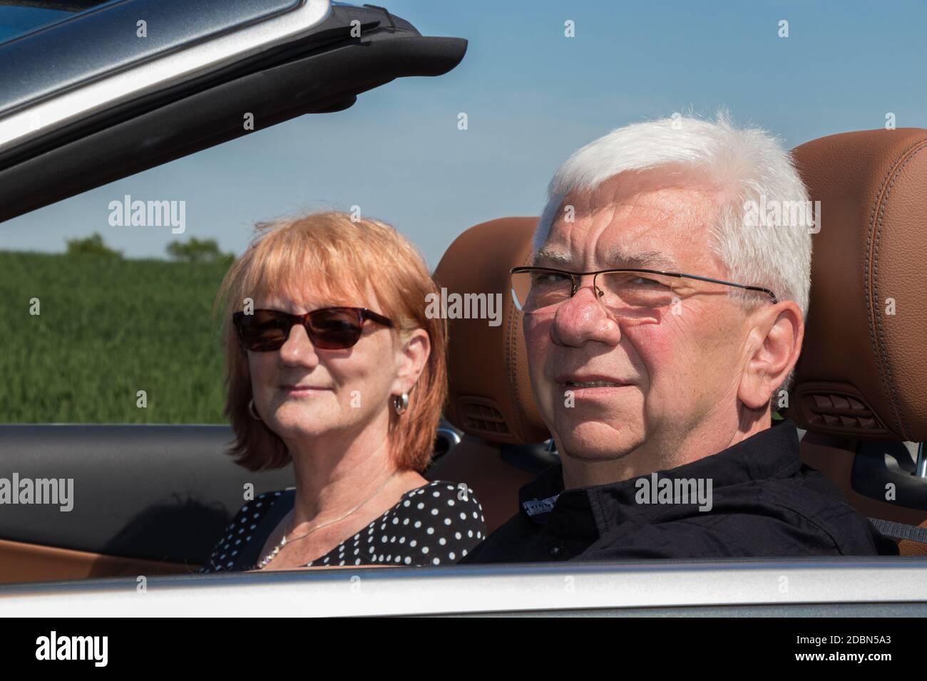 Happy elderly couple sports car hi-res stock photography and images - Alamy