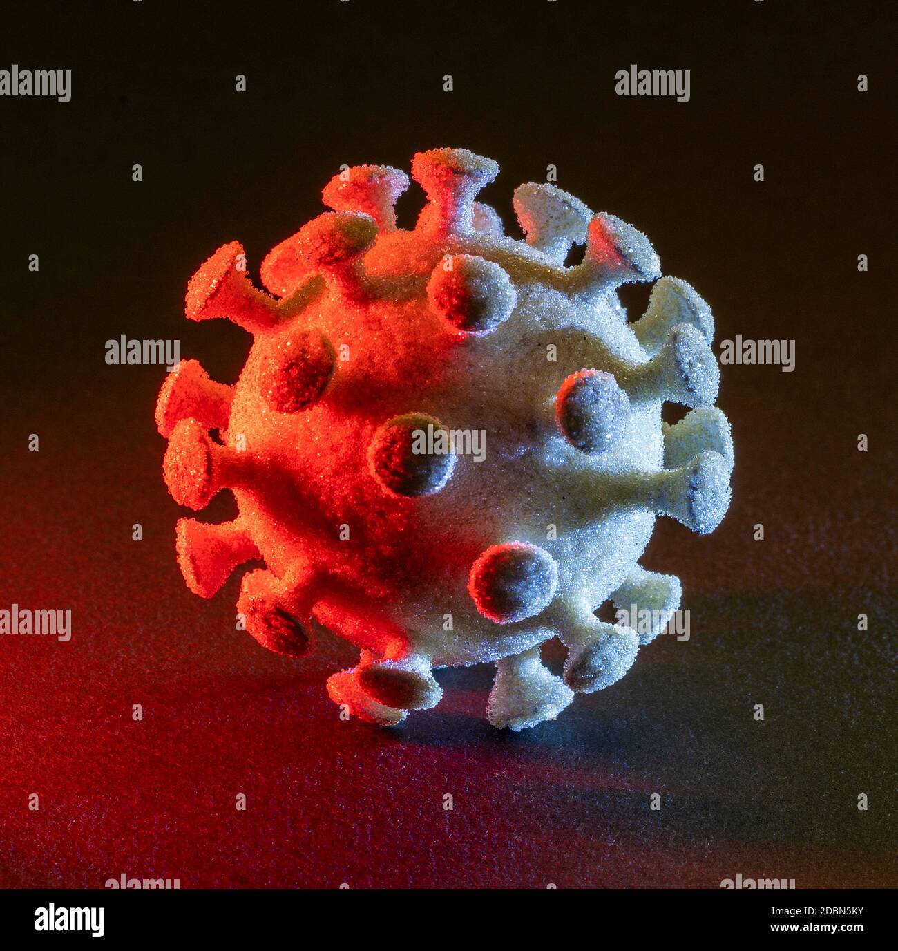 a colorful illuminated symbolic virus in dark back Stock Photo - Alamy