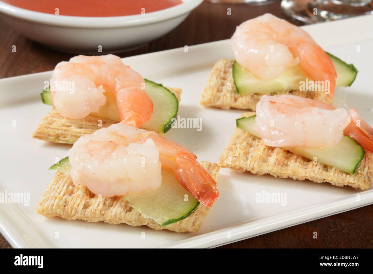 Shrimp prawns with cucumber on wheat crackers as an appetizer Stock ...