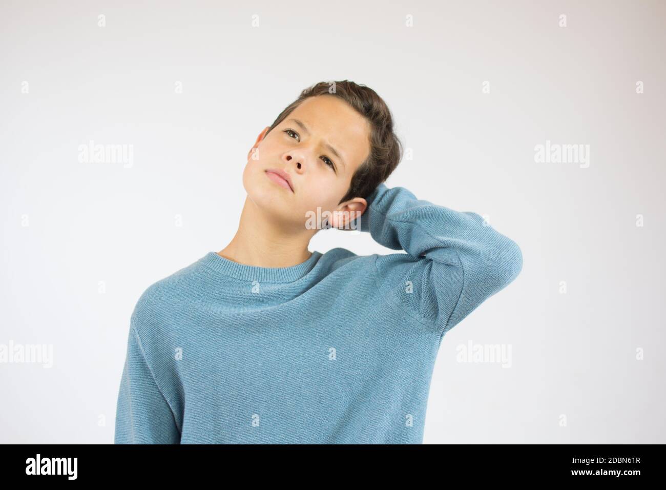 Pensive child with brown hair isolated on white background Stock Photo ...