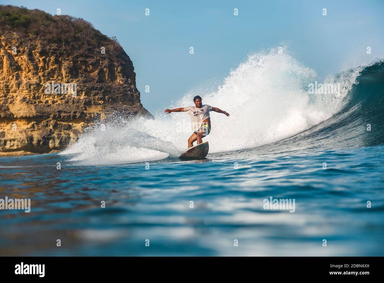Surfer on wave, Kuta, Lombok, Indonesia Stock Photo - Alamy