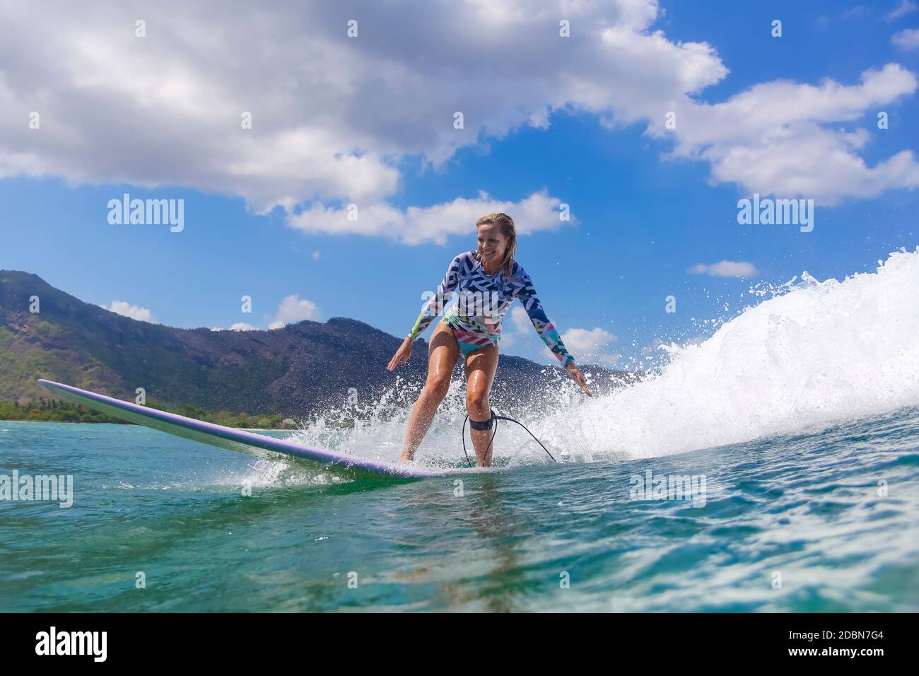 Female surfer riding wave hi-res stock photography and images - Alamy