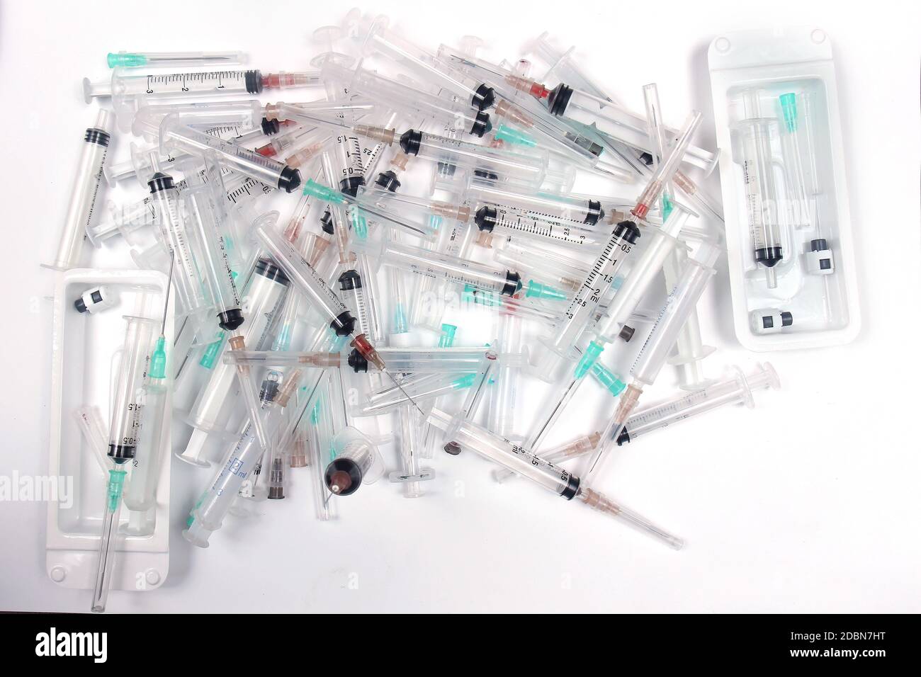 Large pile of used medical syringes with needles Stock Photo - Alamy