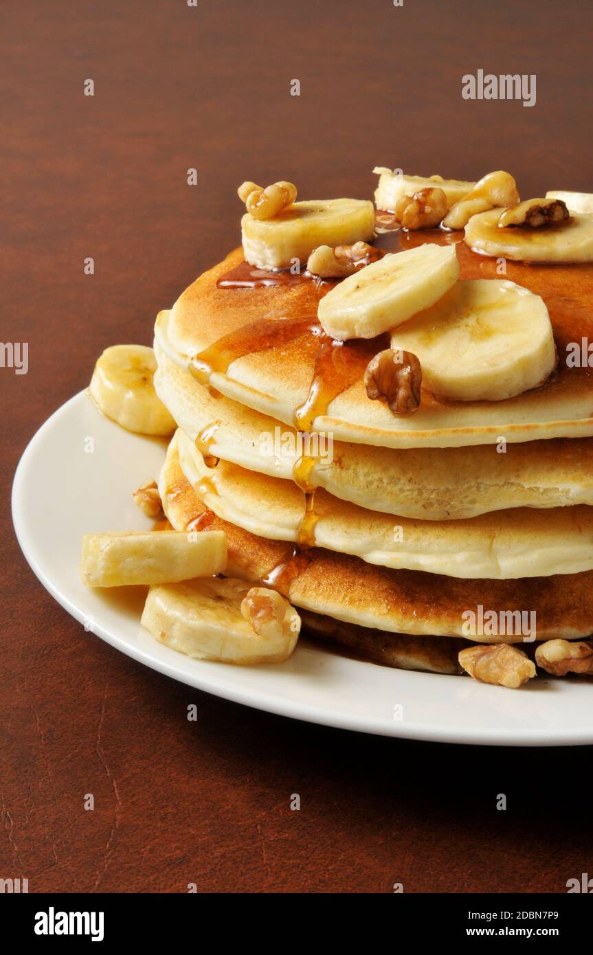 Banana nut pancakes in a vertical composition Stock Photo - Alamy