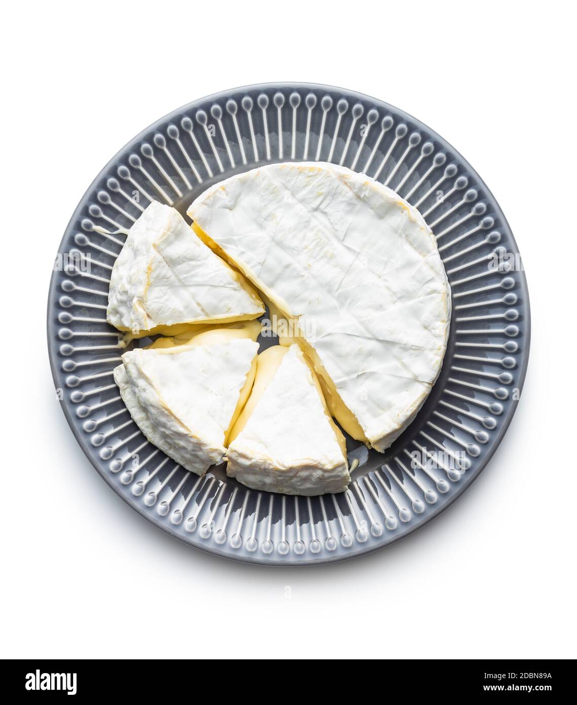 Brie cheese. White soft cheese with white mold on plate isolated on ...