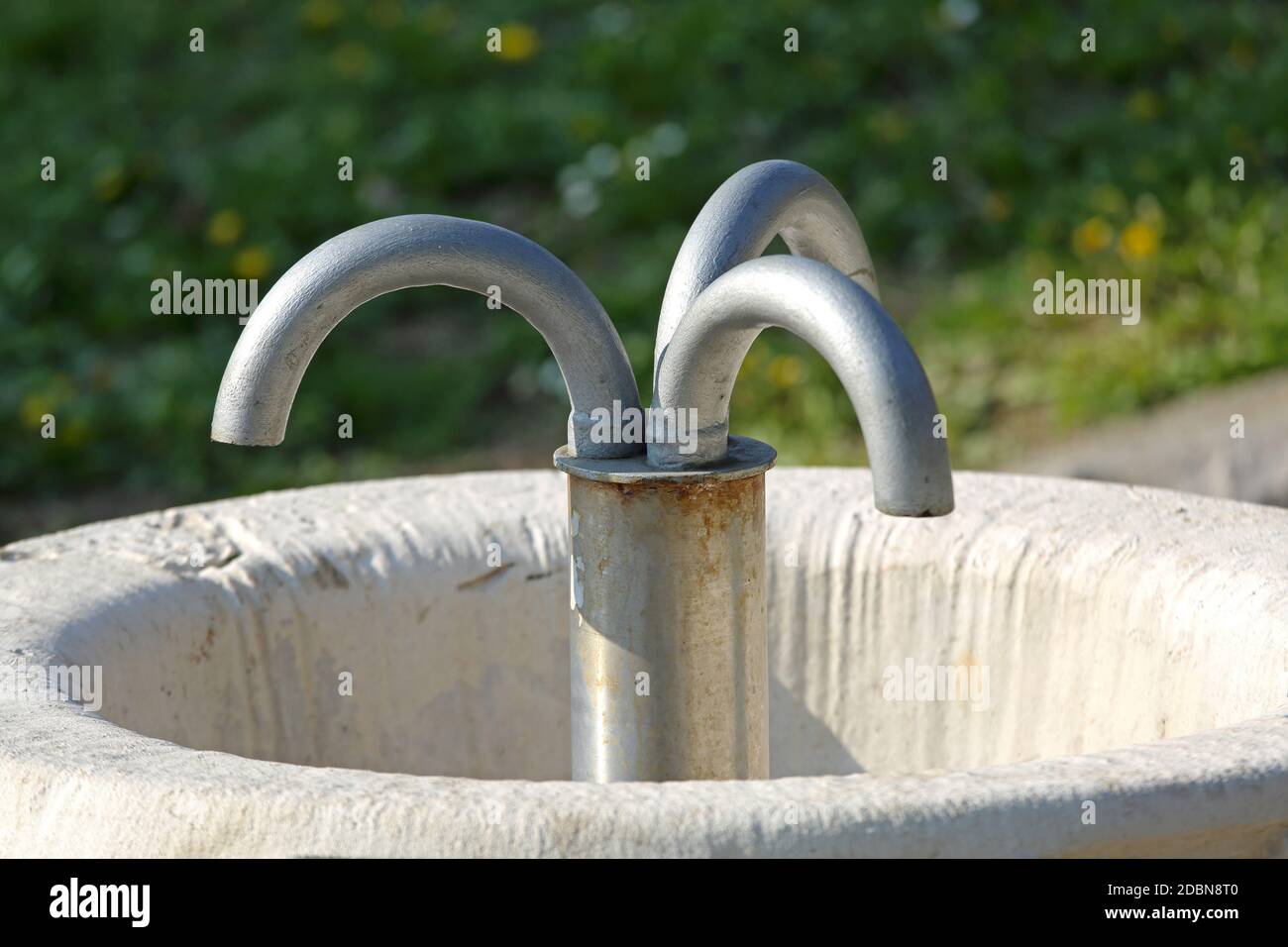 Three Water Pipes at Small Drinking Fountain in Park Stock Photo - Alamy