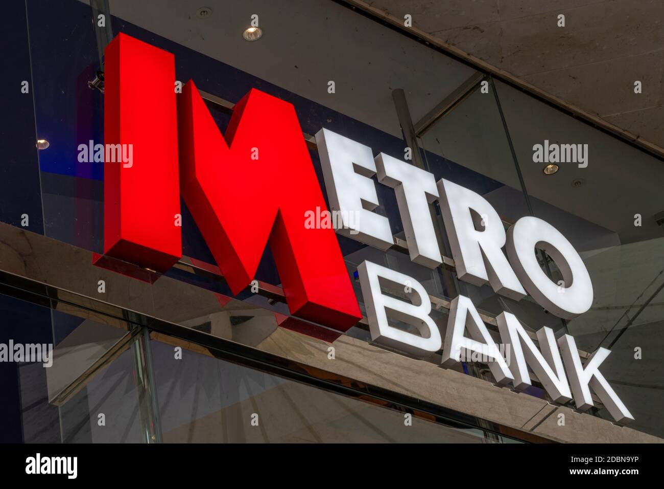 a large illuminated neon metro bank sign on the metro bank branch in ...