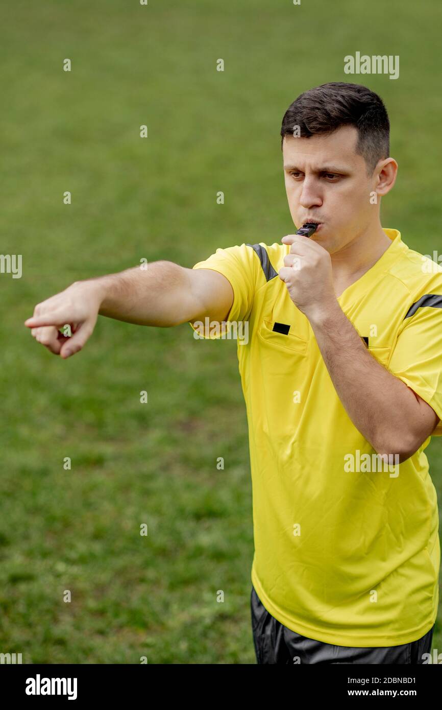 Referee showing on penalty while gaming. Concept of sport, rules ...