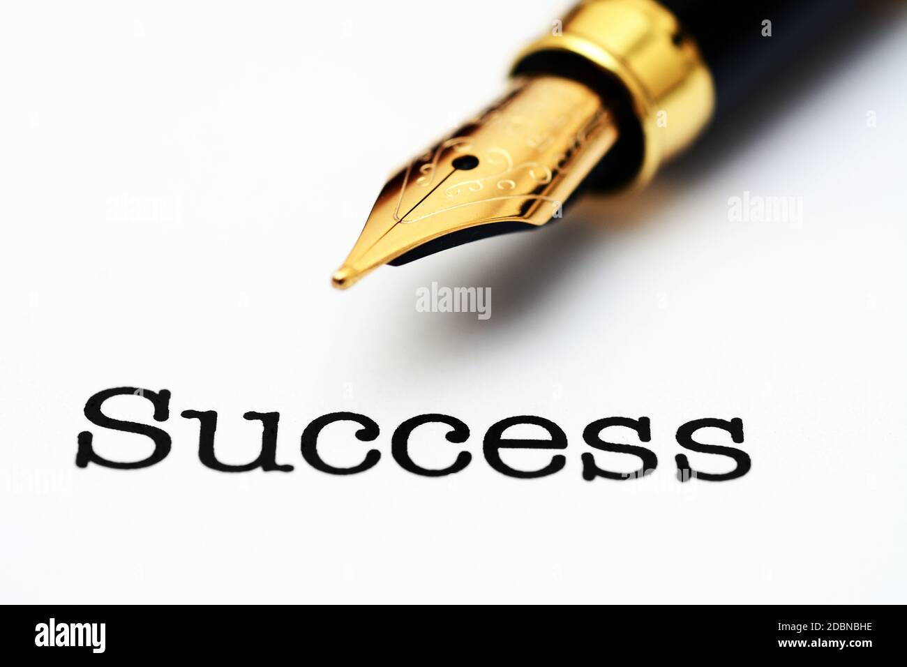 Fountain pen on success text Stock Photo - Alamy