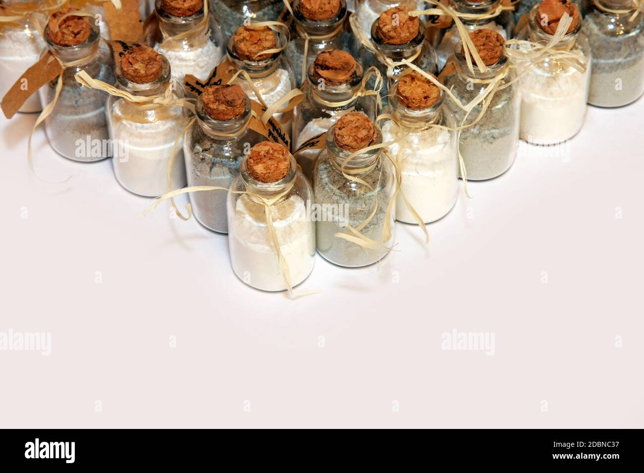 Bunch of small glass jars with powder Stock Photo - Alamy