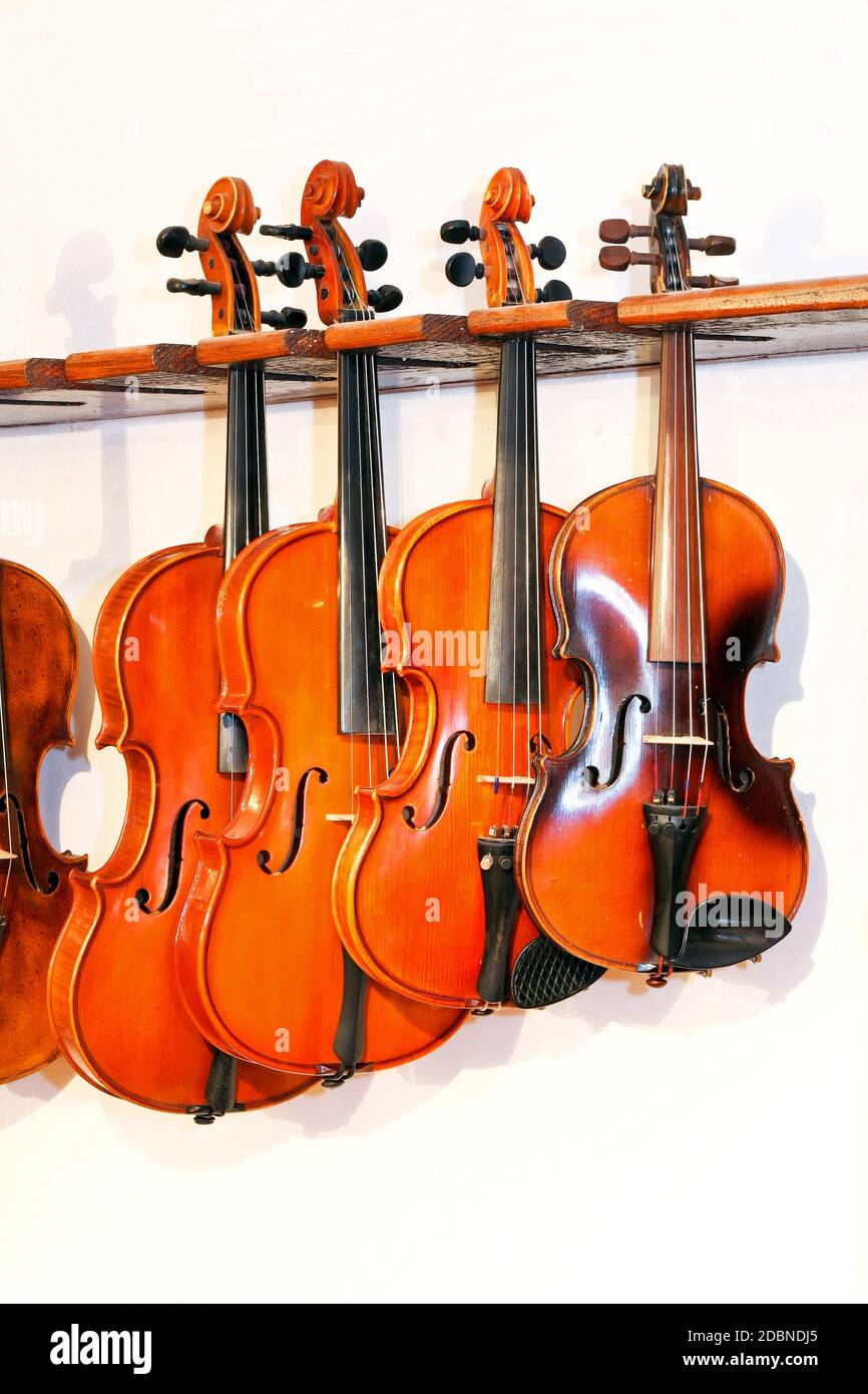 Four hand made violins and violas instruments Stock Photo - Alamy