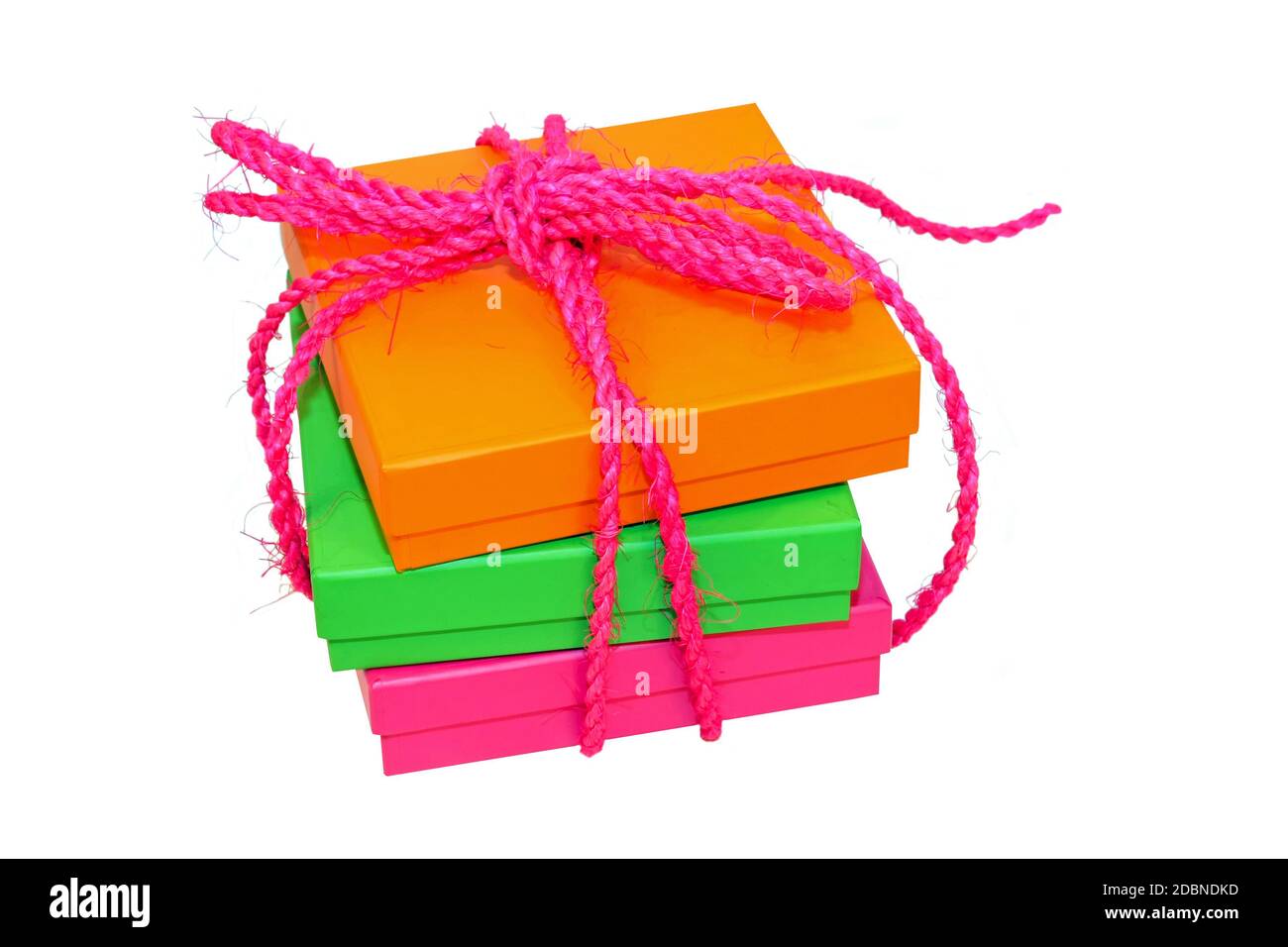 Three vivid color boxes with rope isolated Stock Photo - Alamy