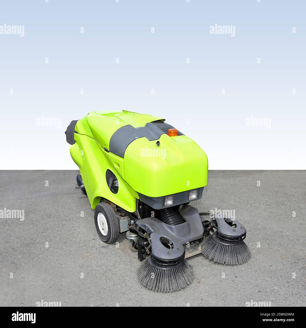Front view of green street sweeper cleaner Stock Photo - Alamy