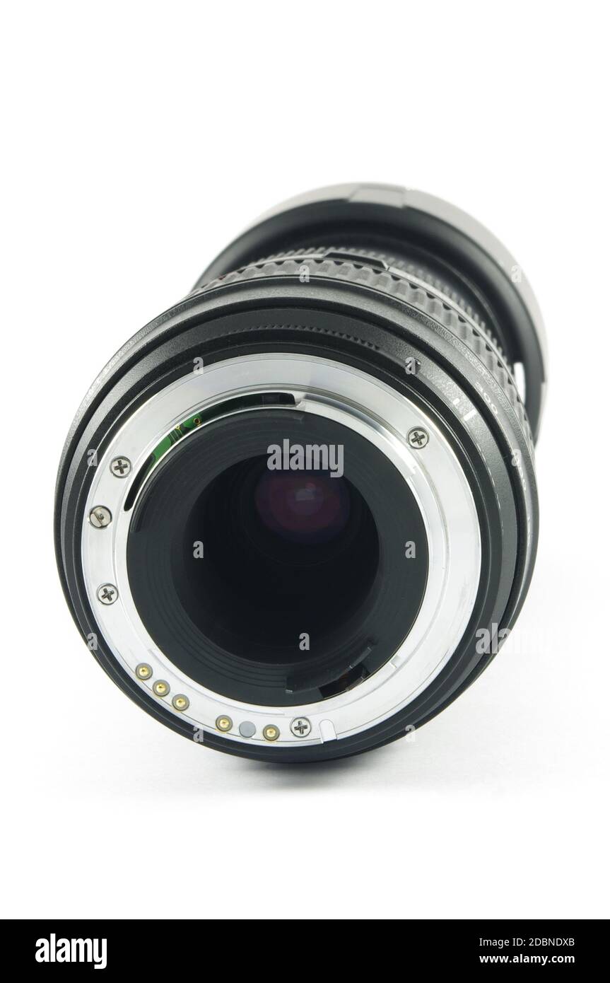 Camera lens lying on the white surface.Back view Stock Photo - Alamy