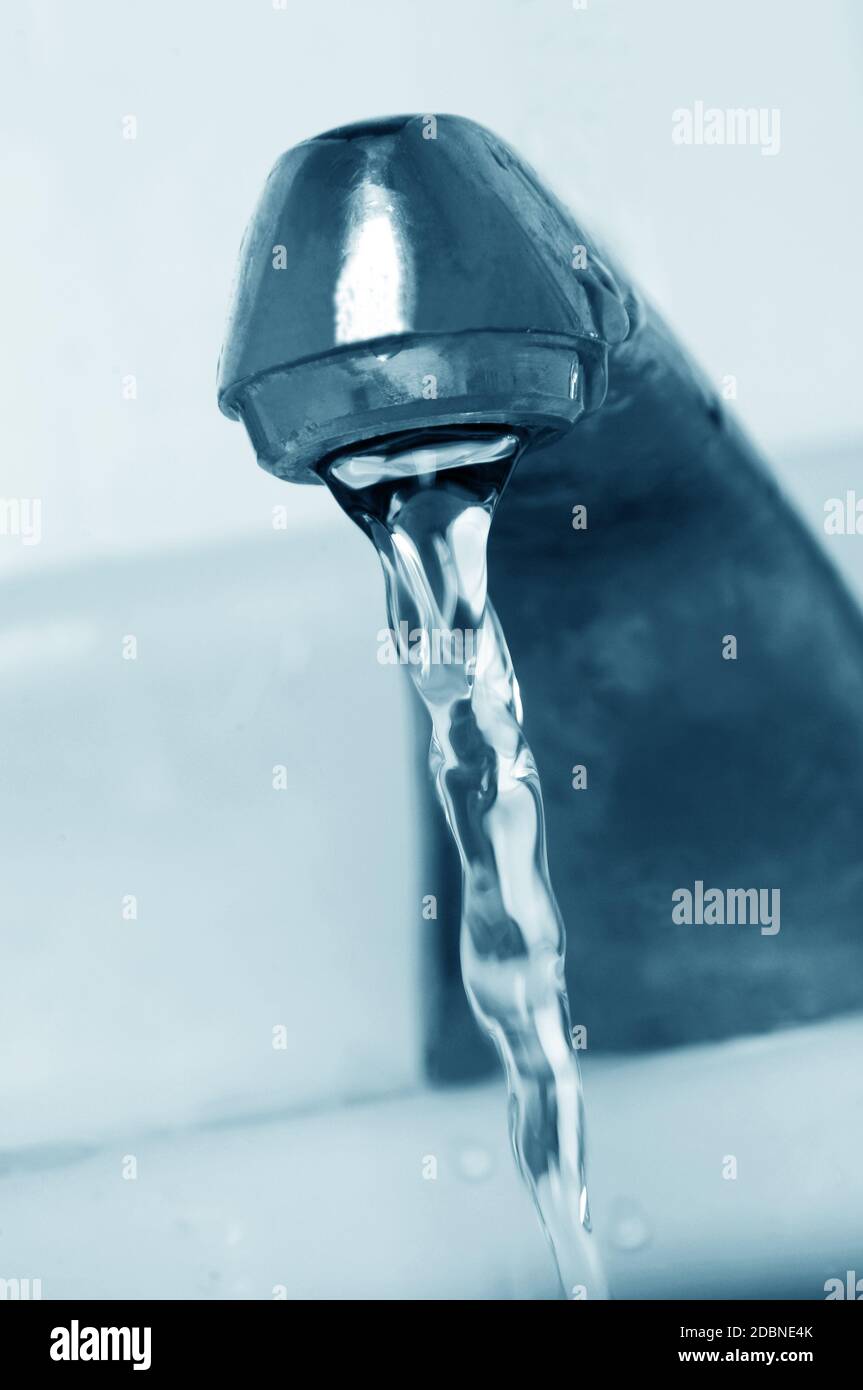 old water tap with running water Stock Photo - Alamy