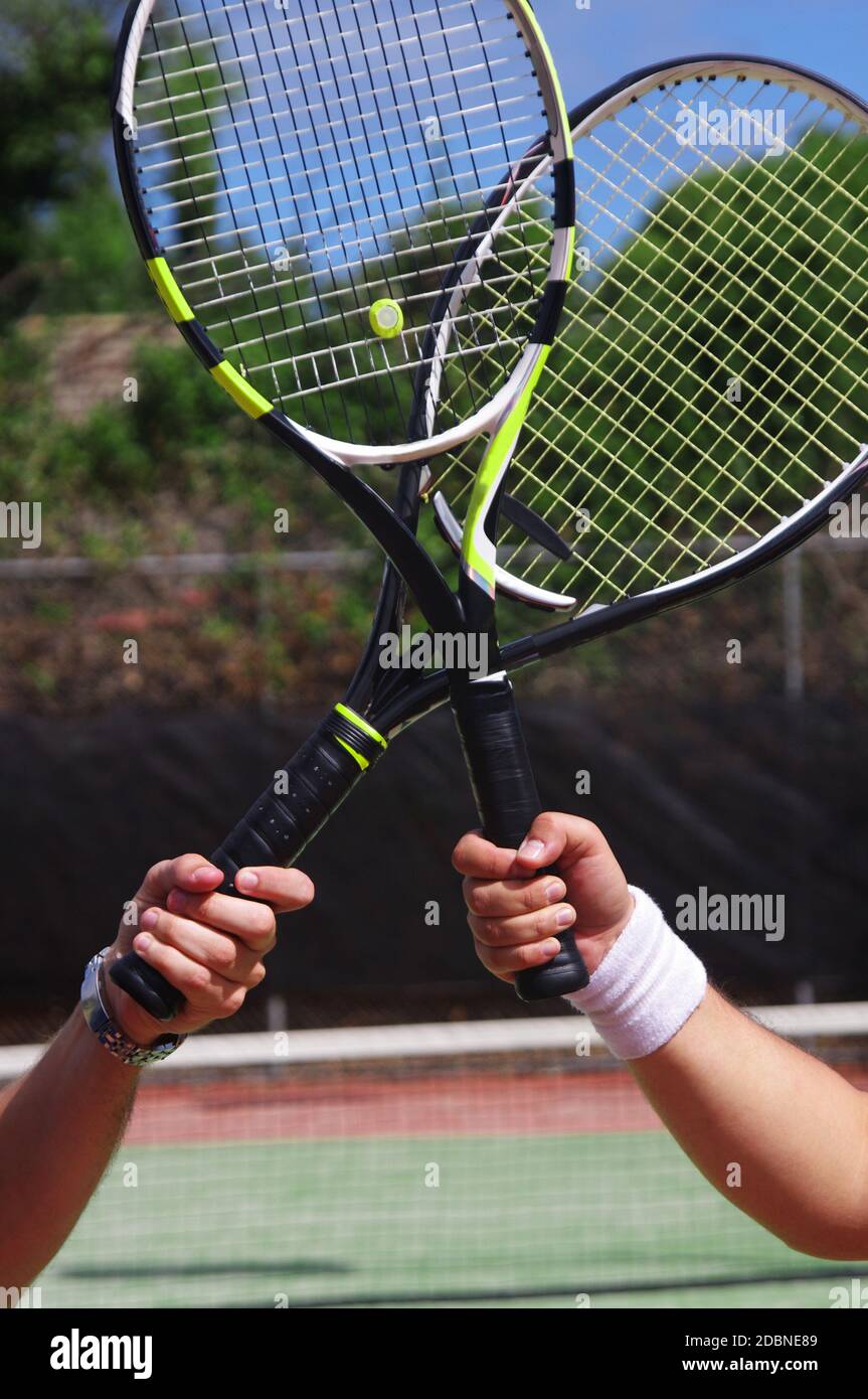 two tennis players with rackets Stock Photo - Alamy