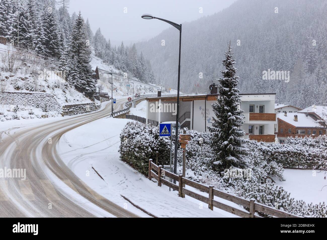 Winter road covered in snow, Val Gardena, Italy Stock Photo - Alamy