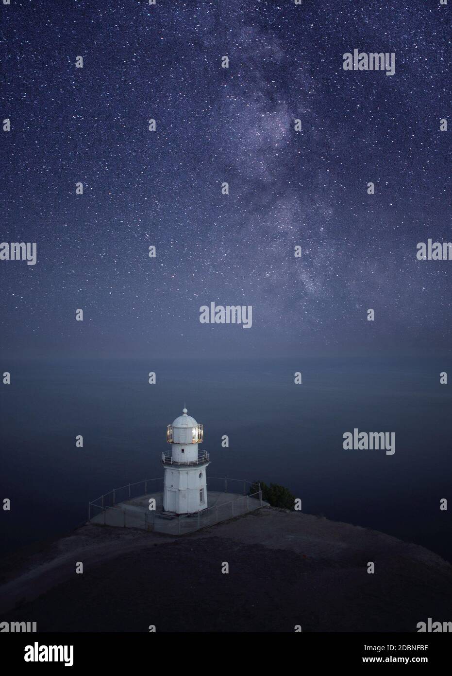 Lighthouse at night with starry sky and Milky Way Stock Photo - Alamy