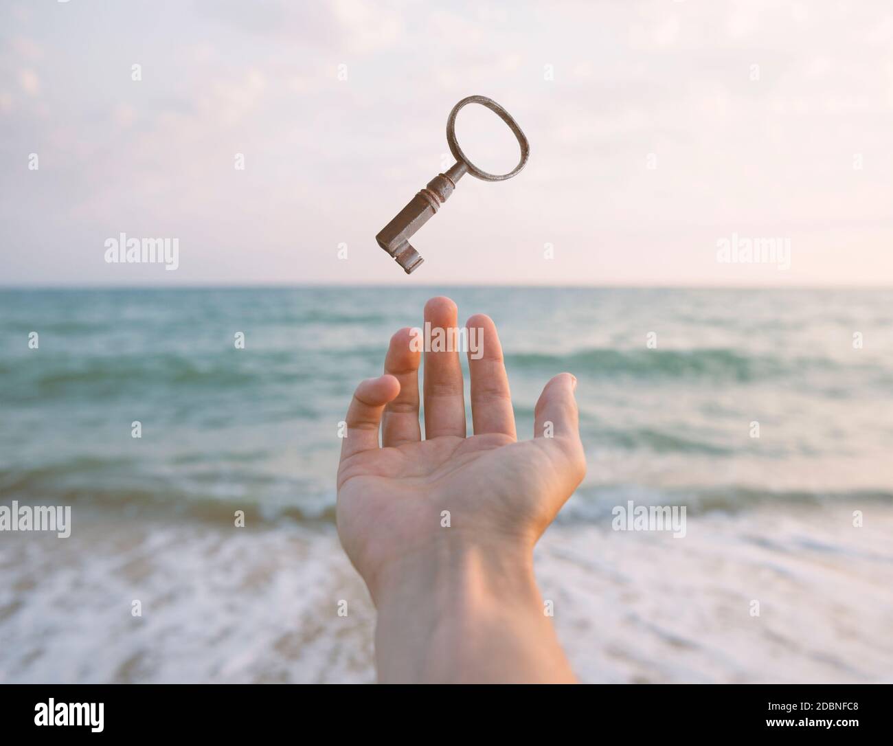 Vintage key throwing in the air Stock Photo - Alamy