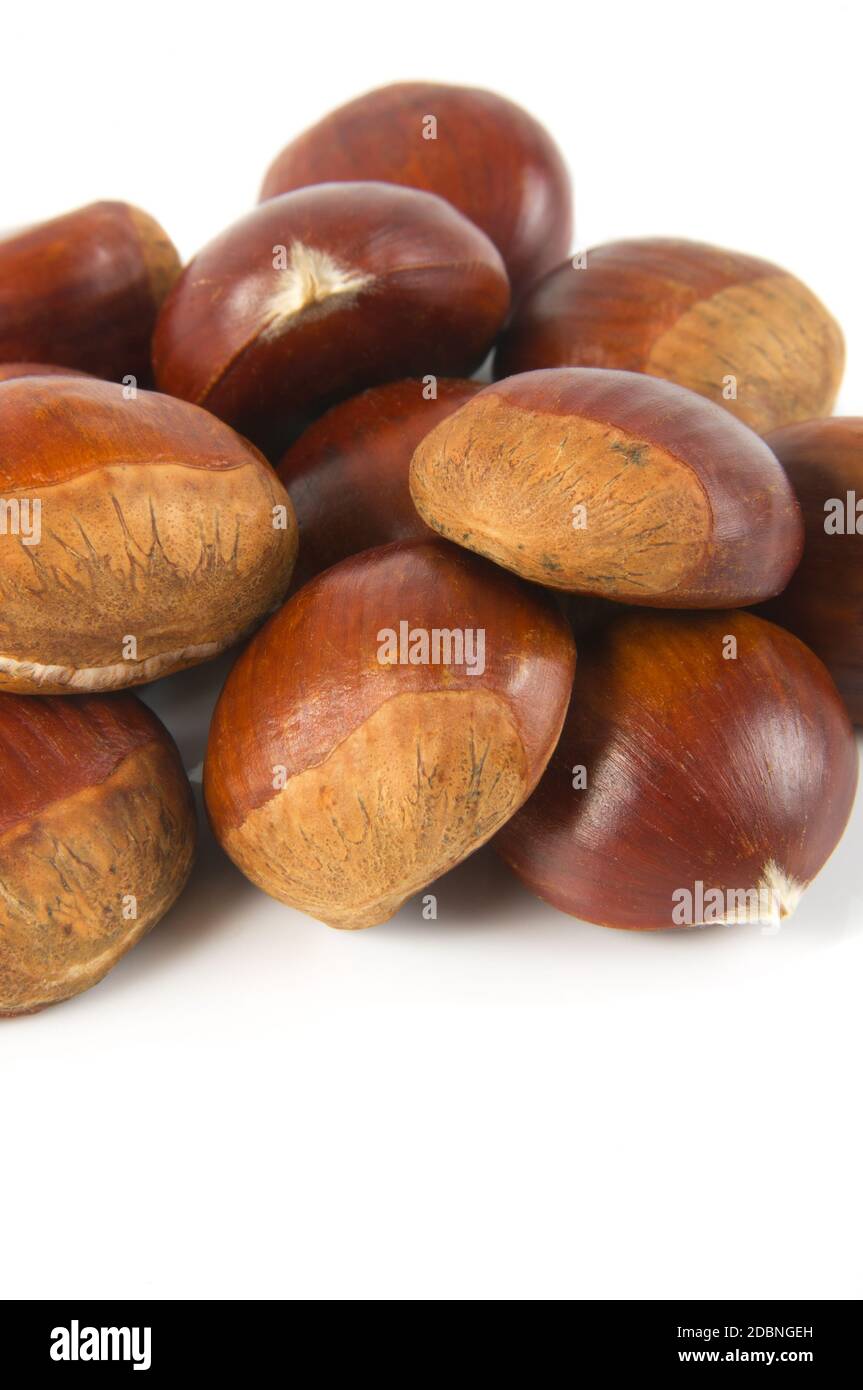 delicious chestnuts closeup over white Stock Photo - Alamy
