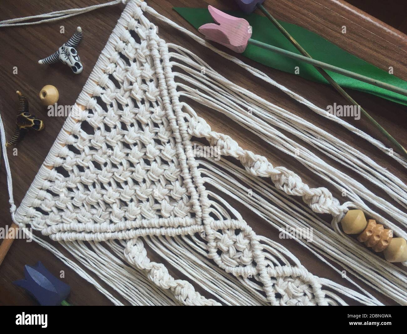 Handmade Macrame wall hanging home decor photo with flowers Stock Photo ...