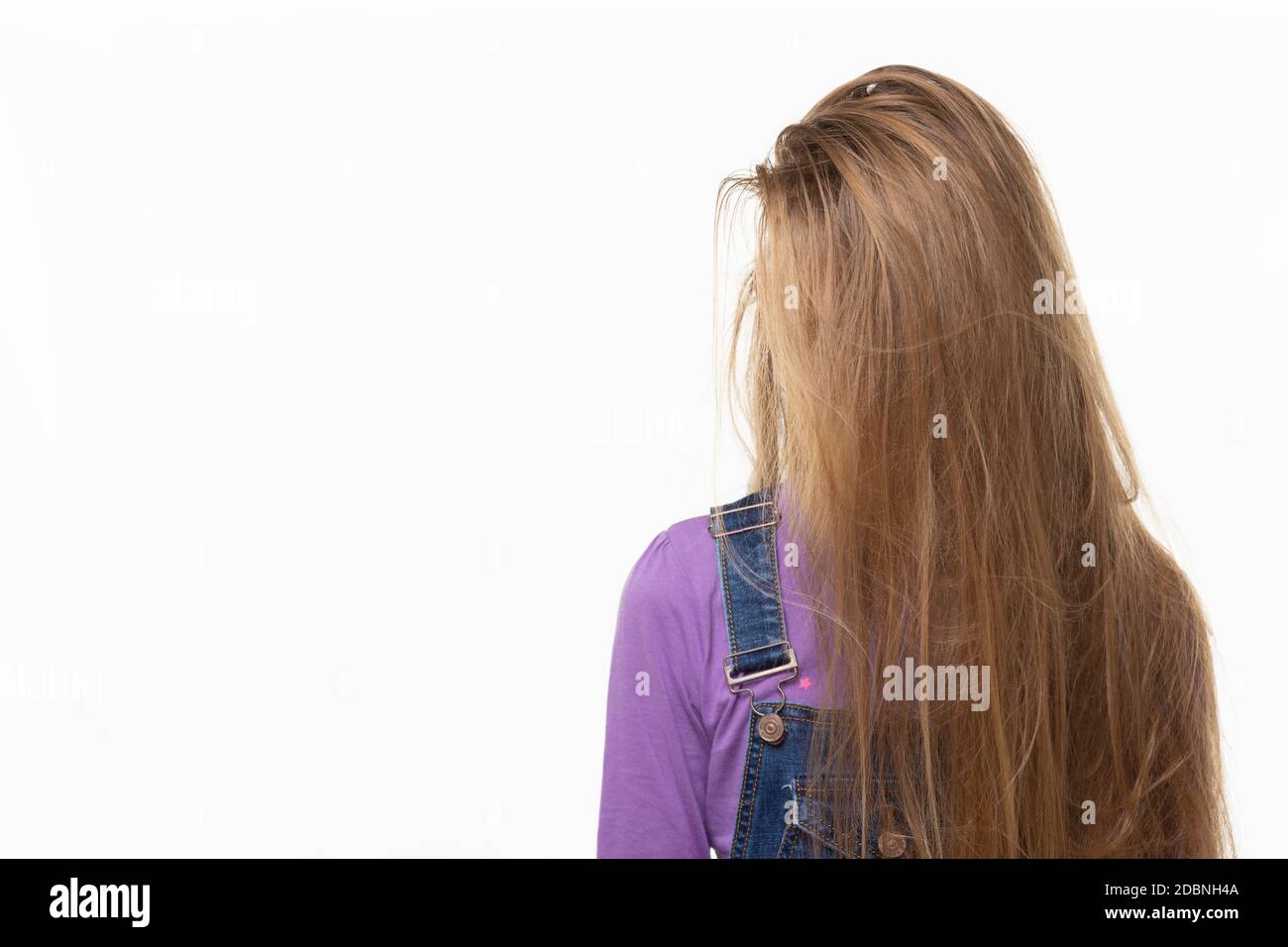 Teen girl covered her face with long hair Stock Photo - Alamy