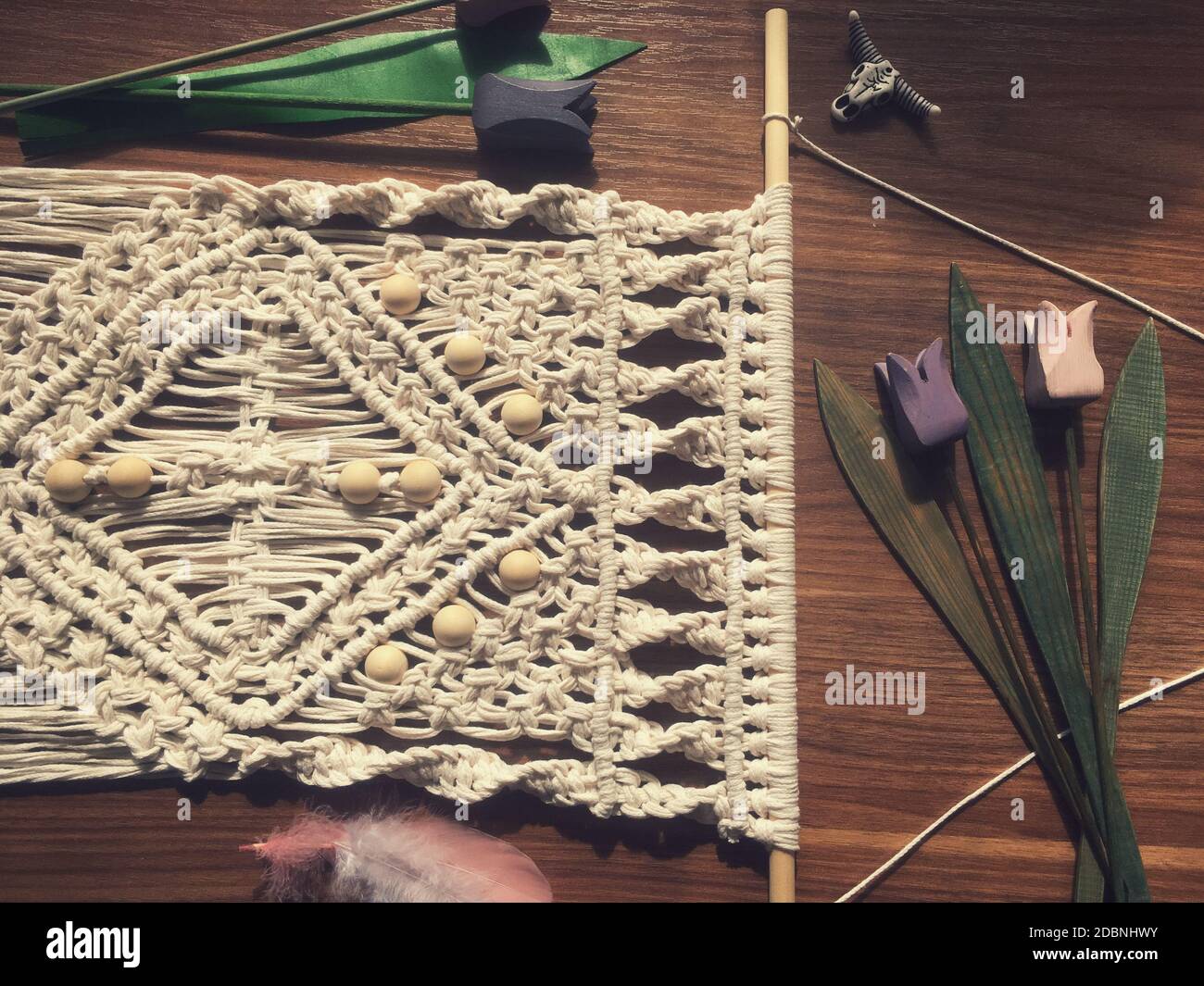 Handmade Macrame wall hanging home decor photo with flowers Stock Photo ...