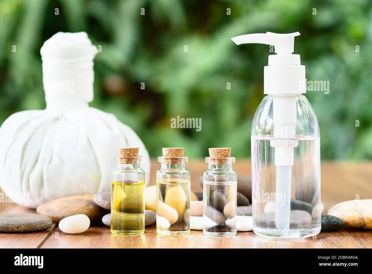 Thai Spa massage setting with bottle with essential oil and thai herbal ...