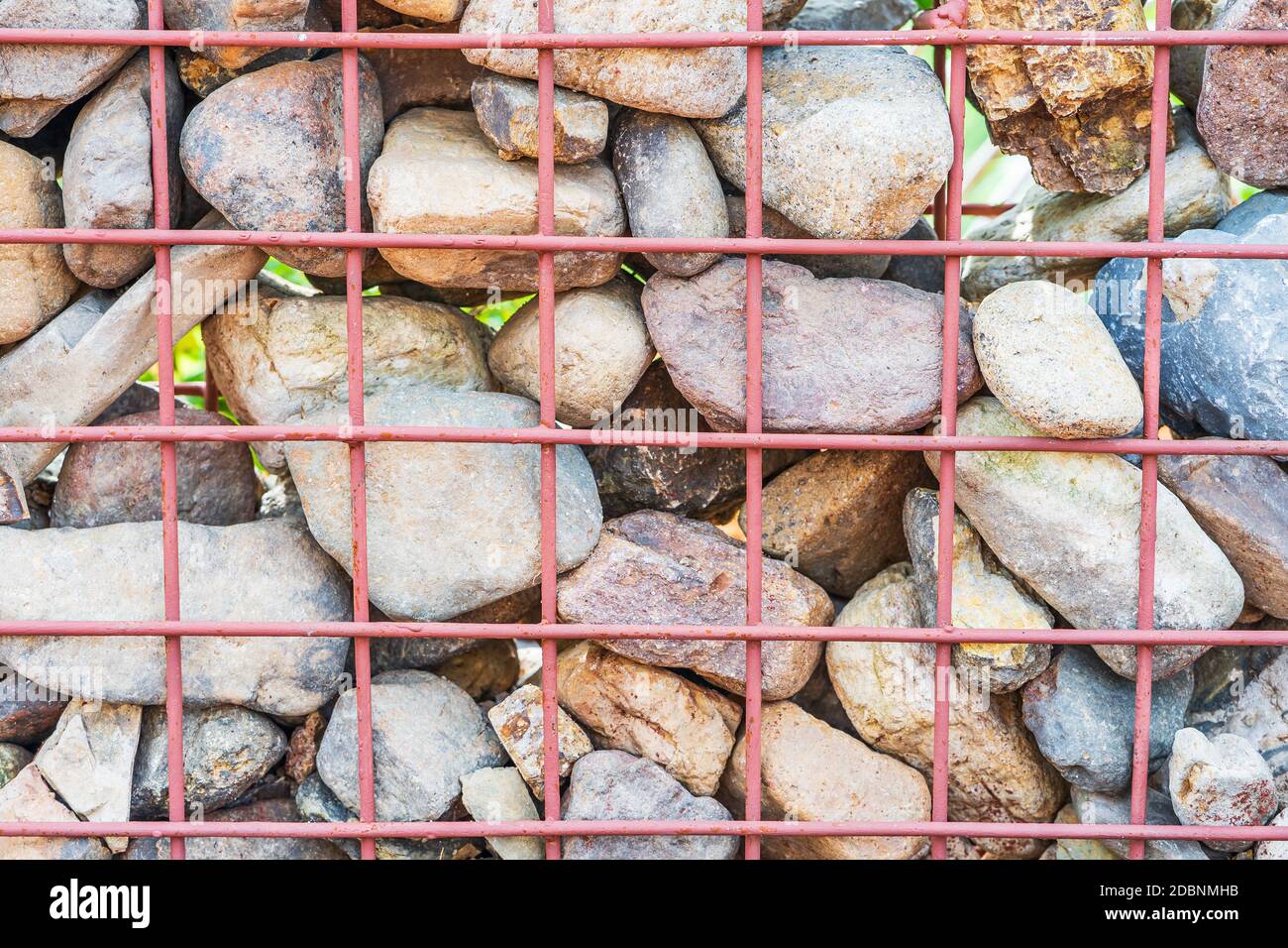 The fence of the wall made of stone The stone wall is tied around with ...