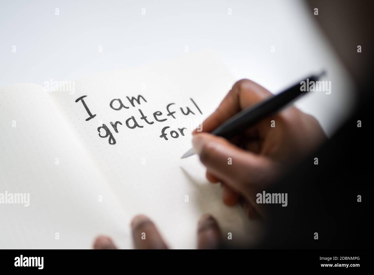 African American Women Writing In Gratitude Journal Stock Photo - Alamy