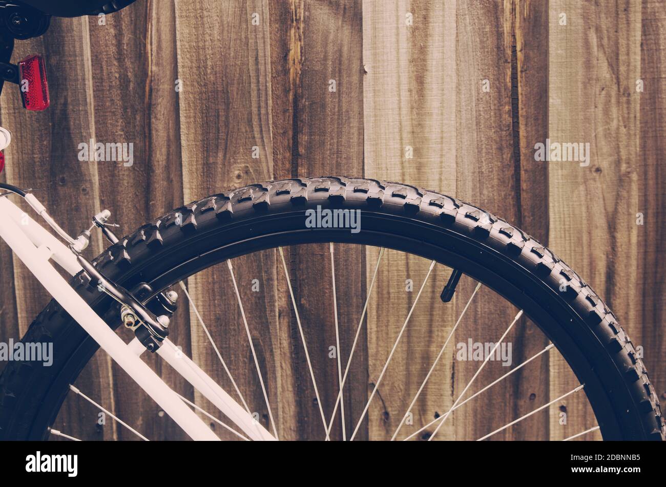 bicycle wheel outdoor near fence Stock Photo - Alamy