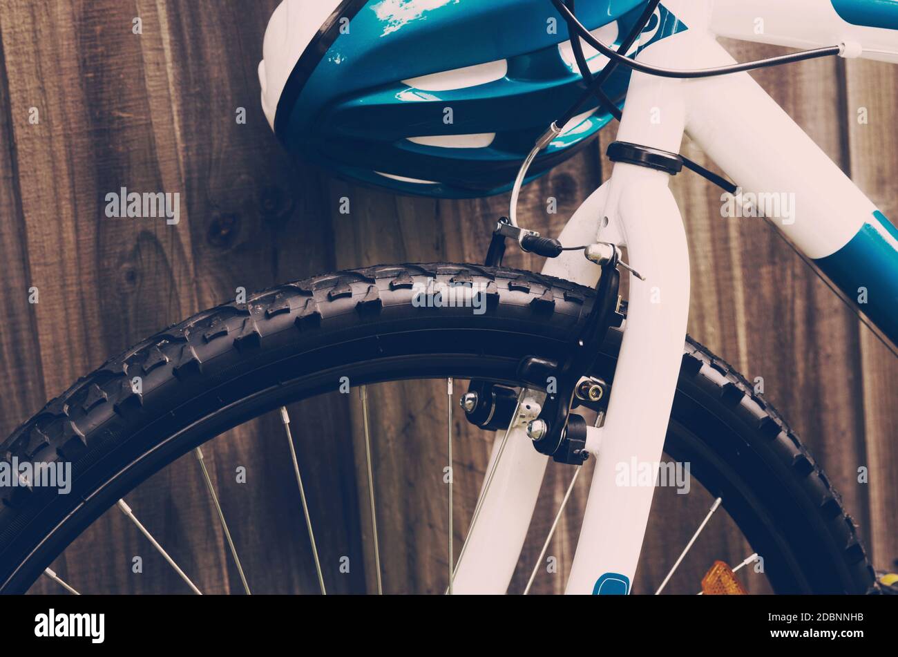 bicycle wheel outdoor near fence Stock Photo - Alamy