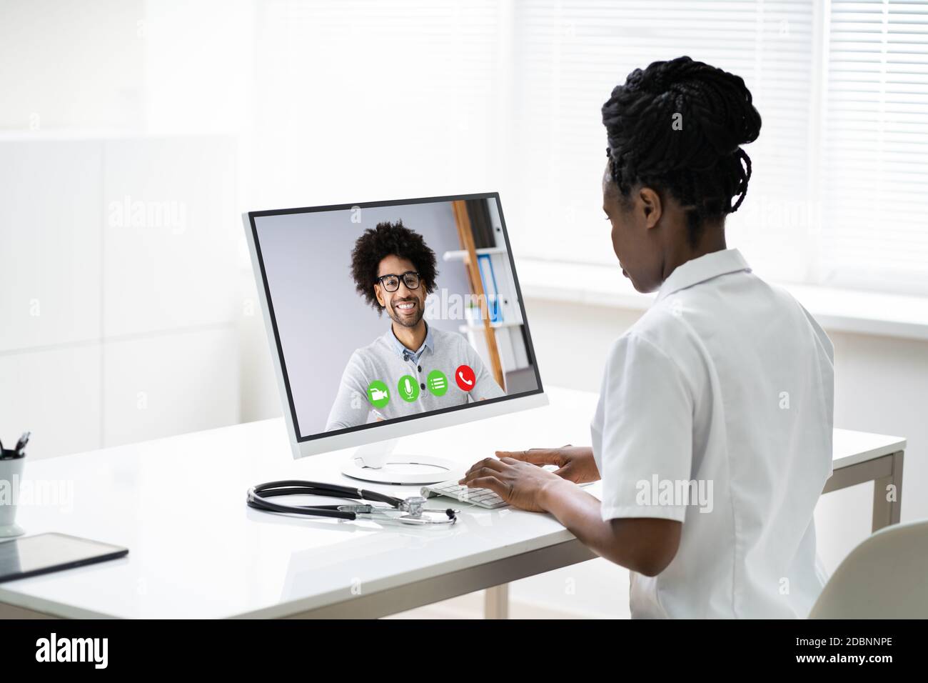 African Doctor In Video Conference Call Talking With Patient Stock ...
