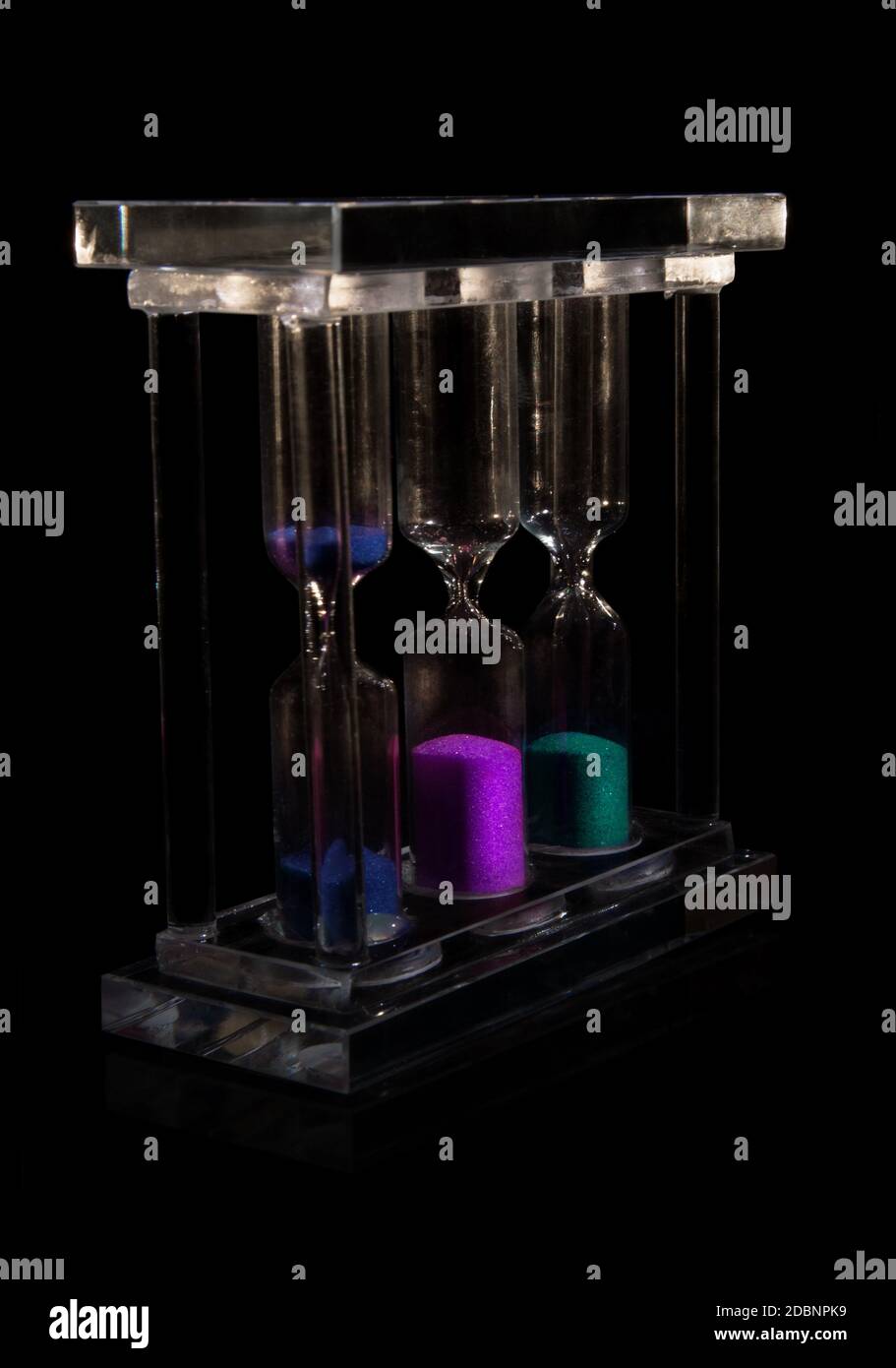 sand clock over dark surface Stock Photo - Alamy