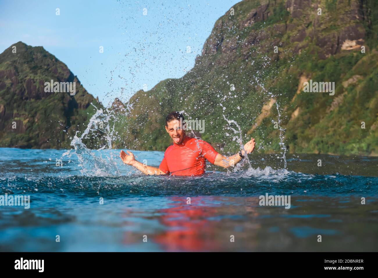 Man splashing in sea, Sumbawa, Indonesia Stock Photo - Alamy