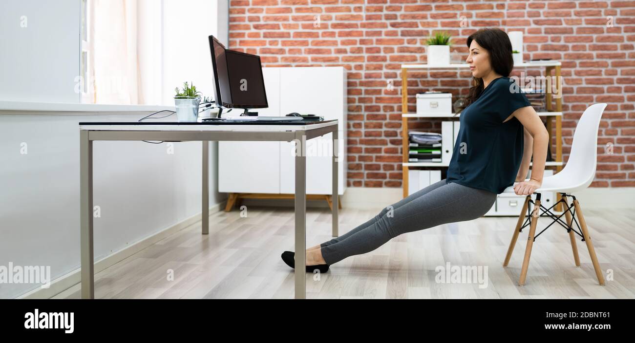 Triceps Dips Chair Exercise At Office Desk Stock Photo - Alamy