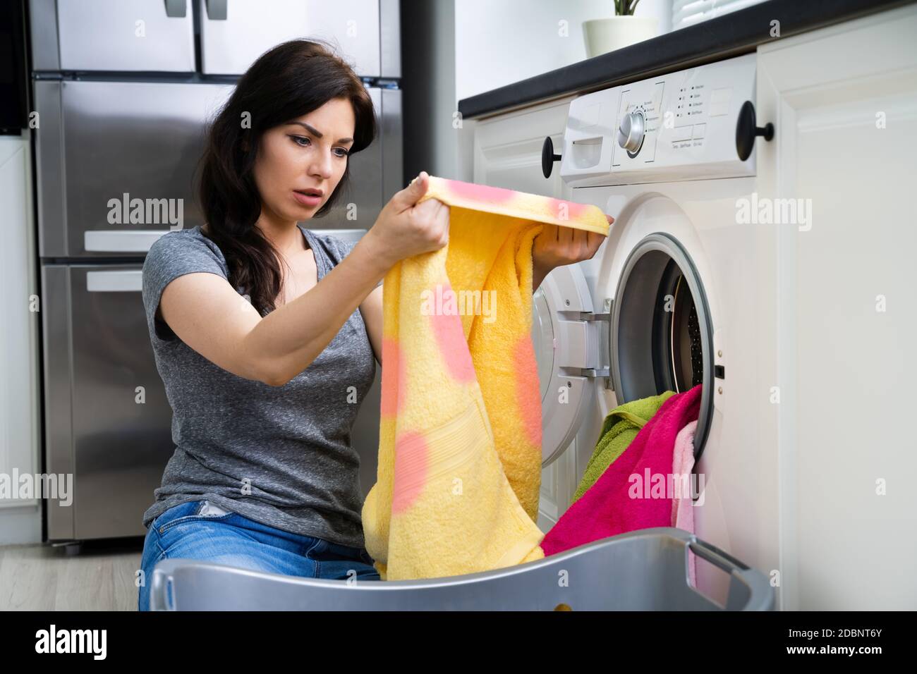 Stained Pink Clothes In Washing Machine. Laundry Cleaning Stock Photo ...