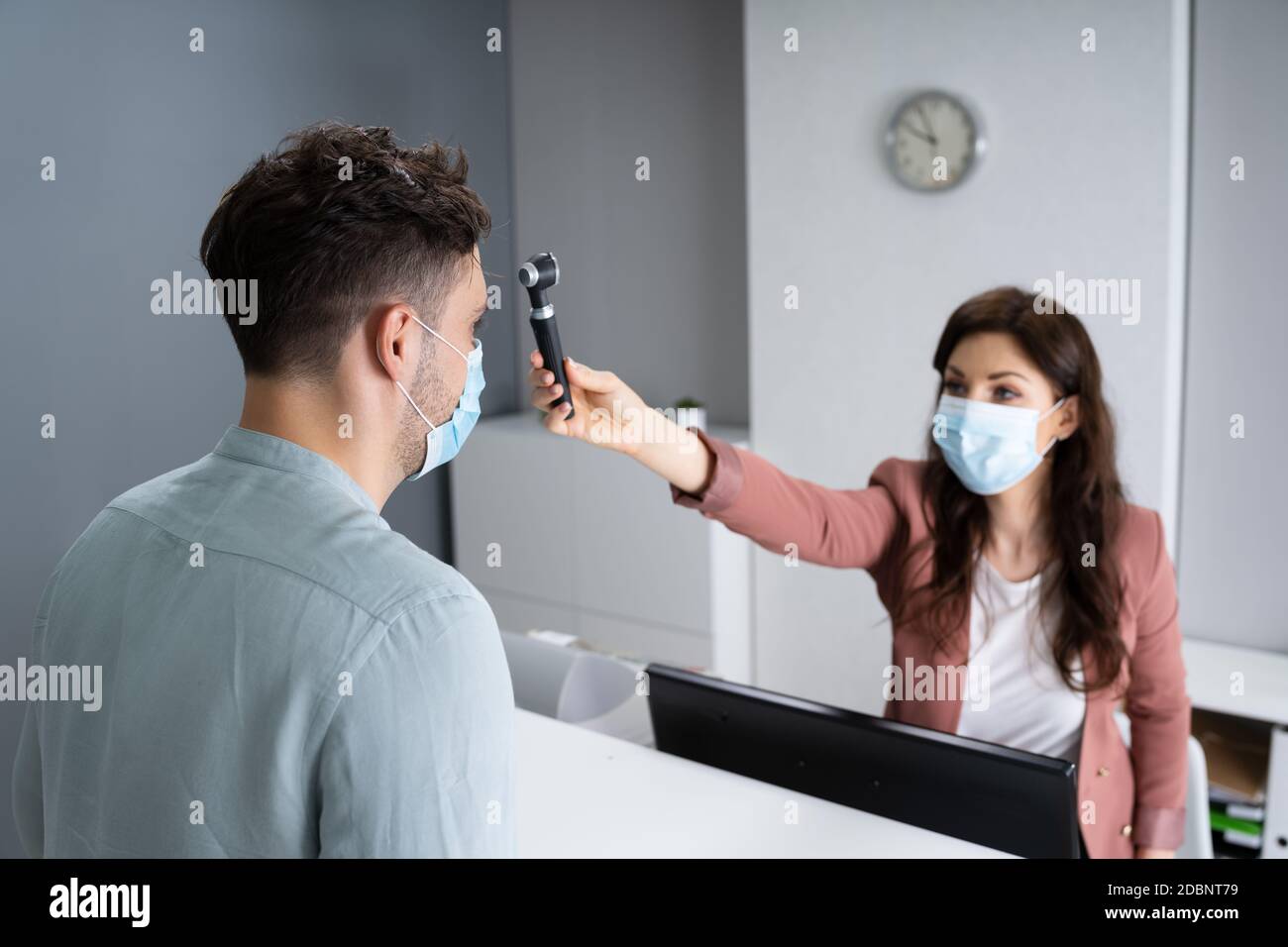 Hotel Reception Desk Temperature Check Protected From Covid 19 Stock ...