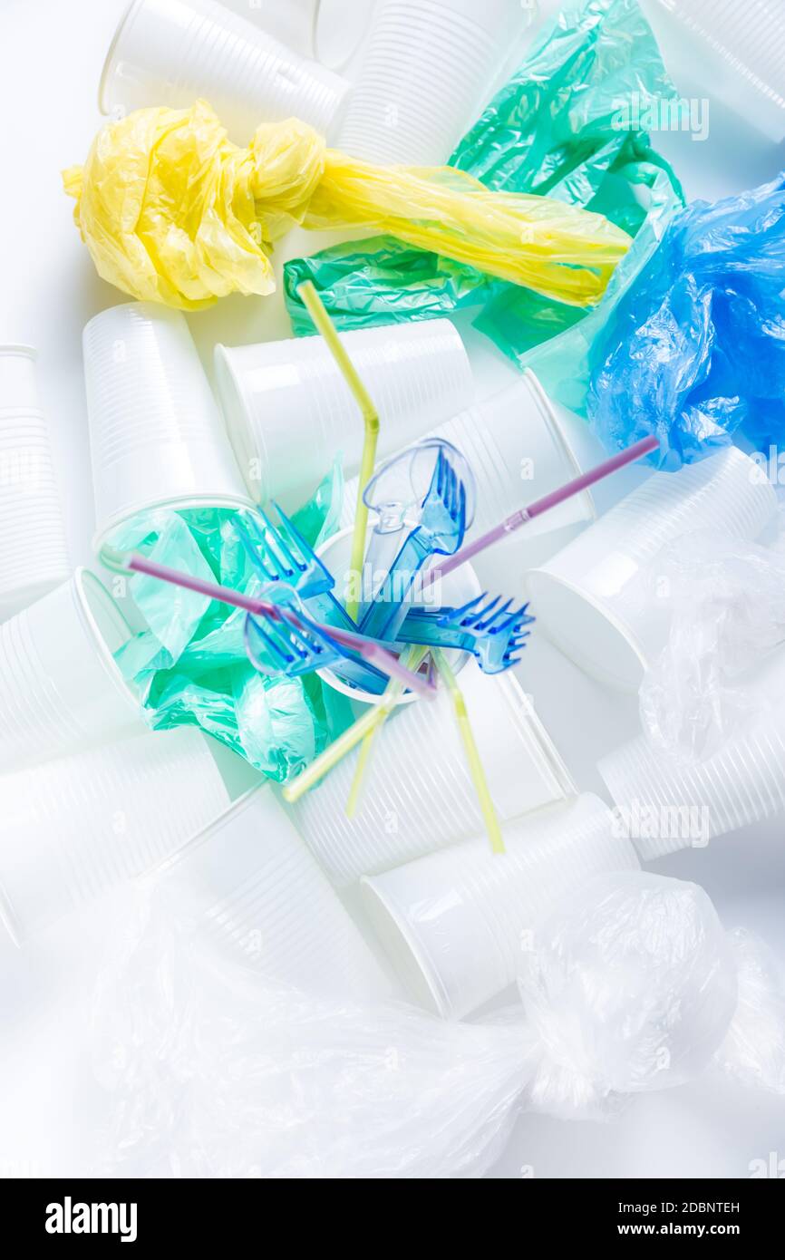 Assortment of disposable plastic, cups, cutlery, bags and drinking ...