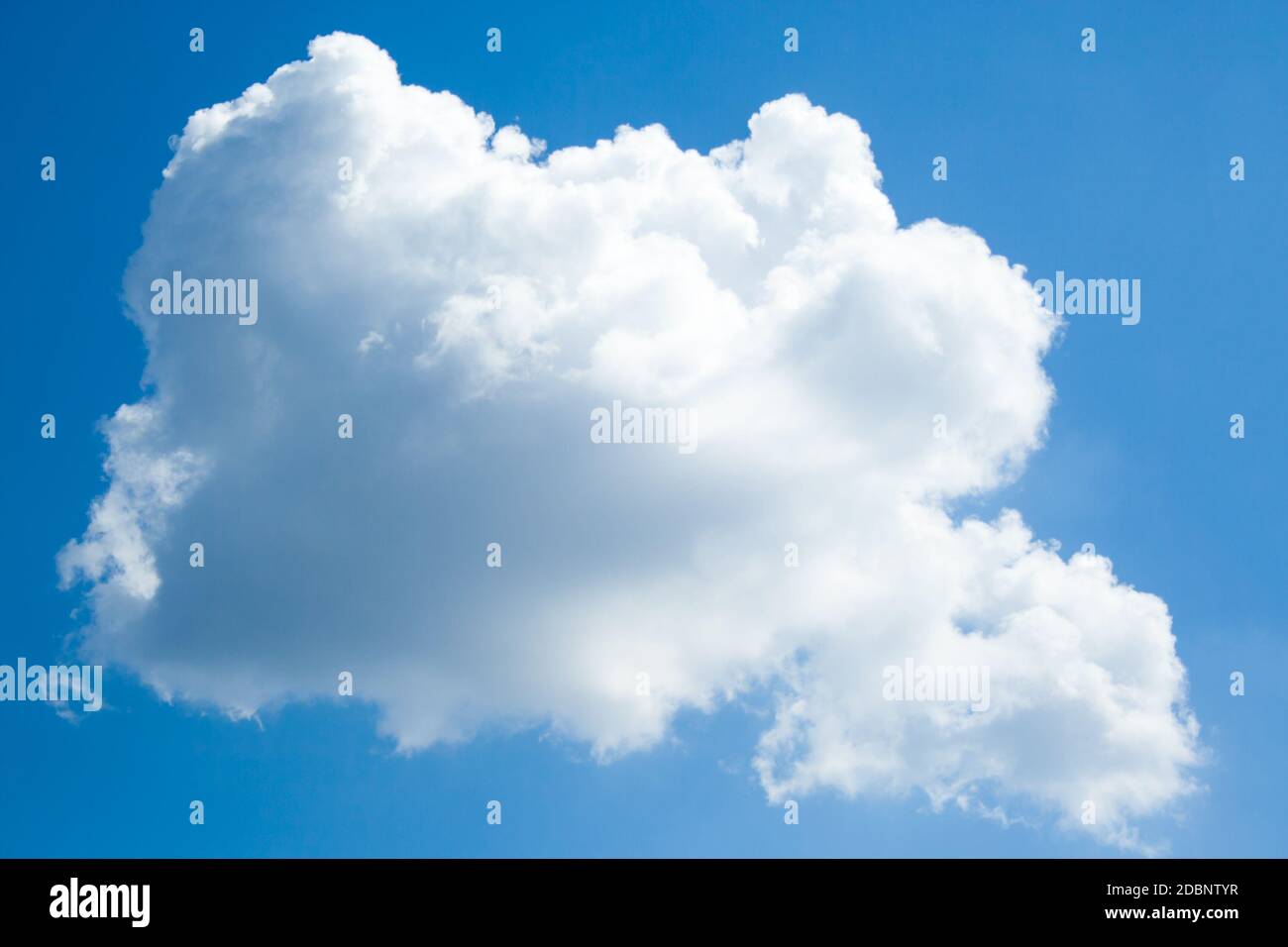 Huge clouds in blue sky lit by the sun, not windy Stock Photo - Alamy