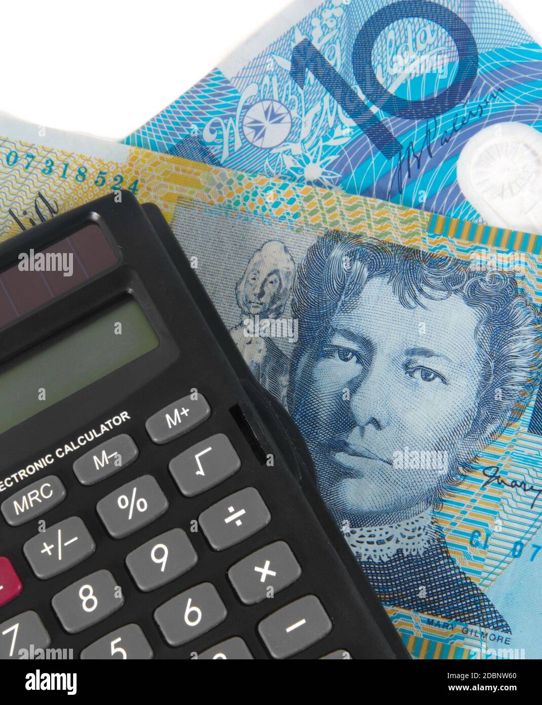 australian cash and calculator over white Stock Photo - Alamy