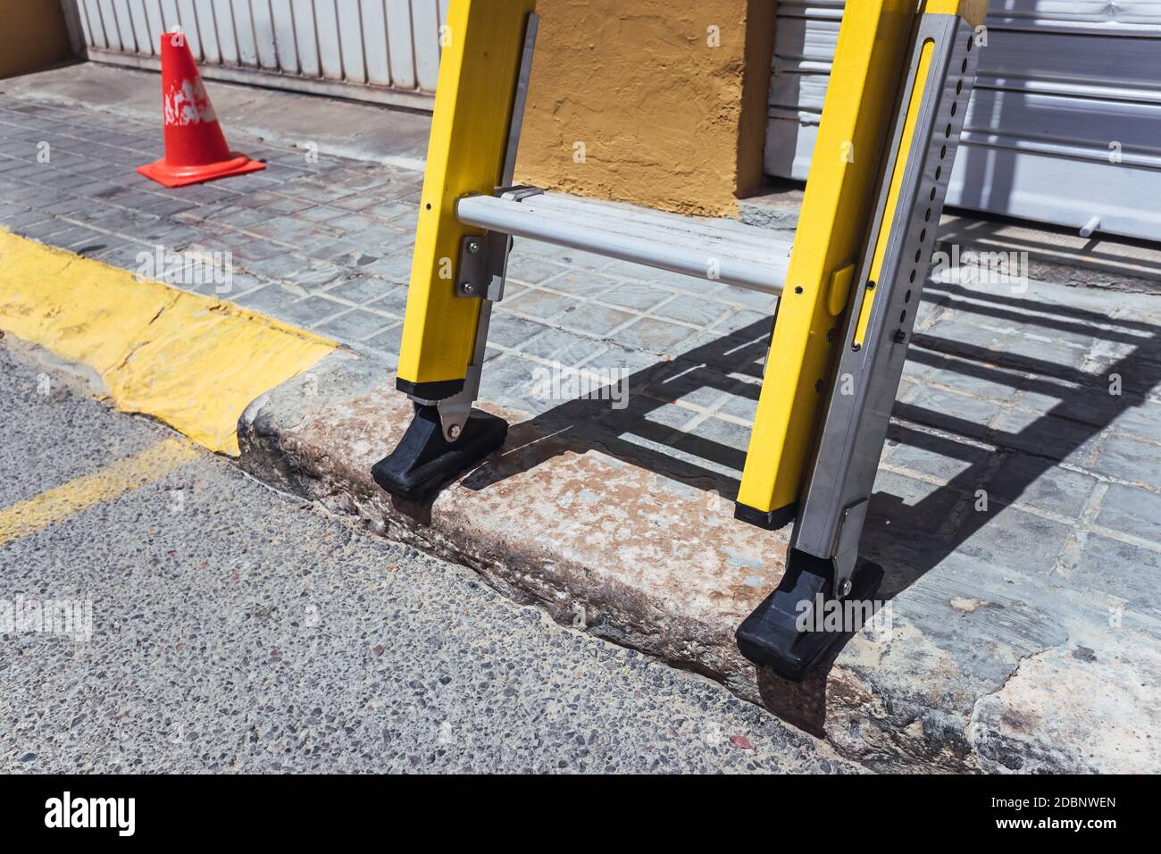 Stepladder on the street during repairs on the facade of a building ...