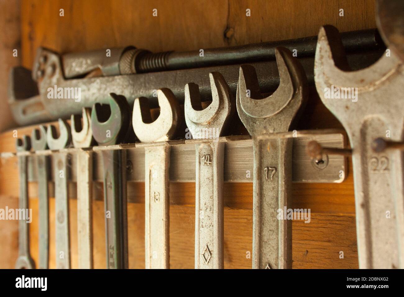 Old rusty spanners are hanging in a row in the shed Stock Photo - Alamy