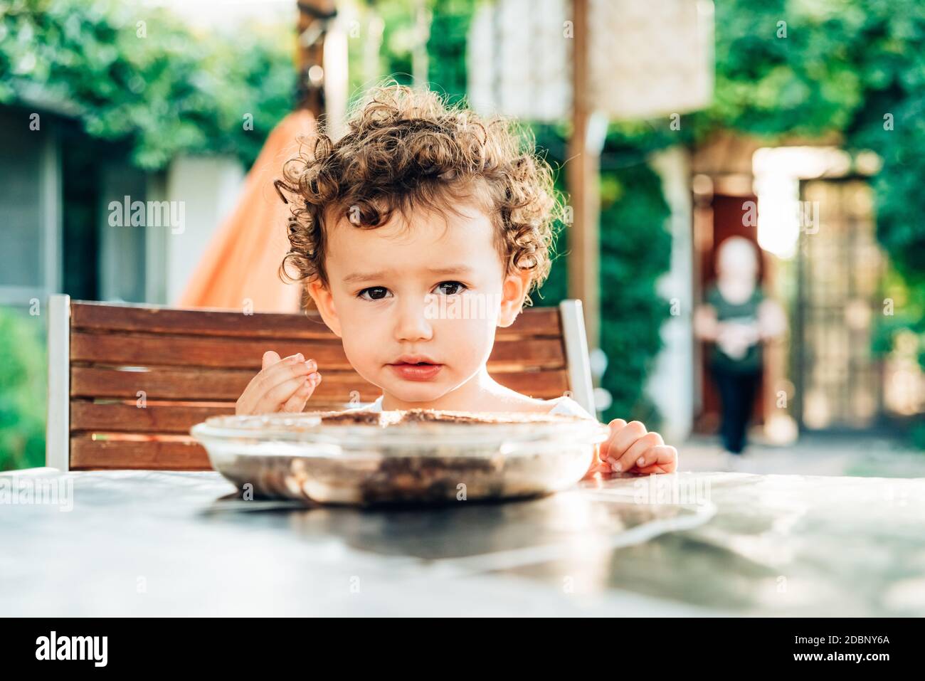 young lady enjoys a chocolate cake for a snack Stock Photo - Alamy