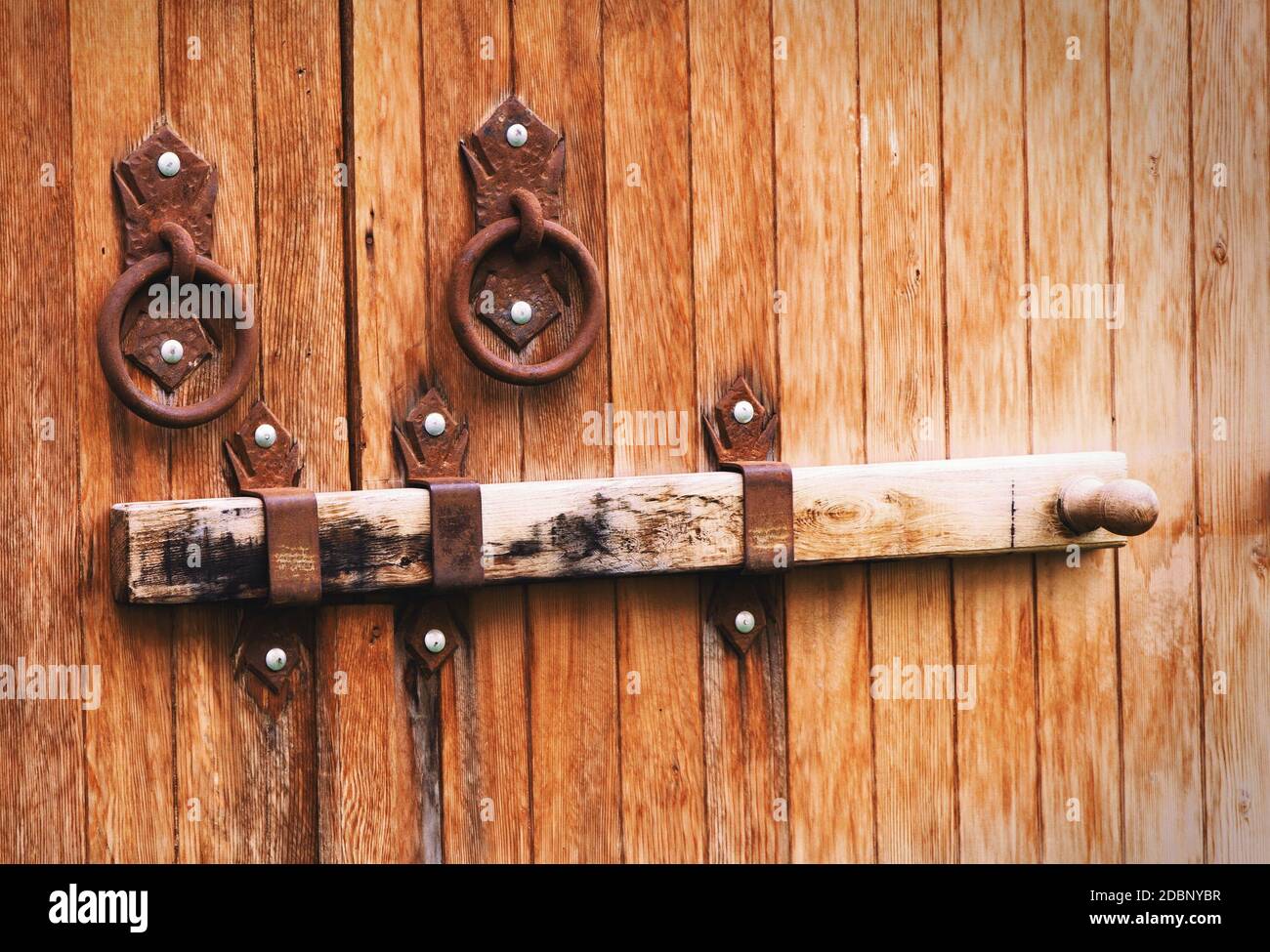 Old antique wooden gate lock Stock Photo - Alamy