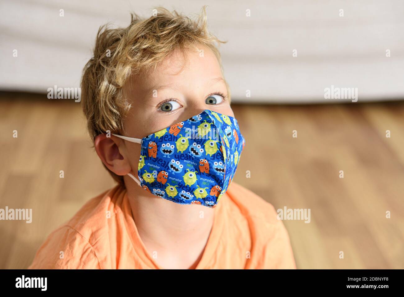 A face with an expression of astonishment in a child with a mask Stock ...