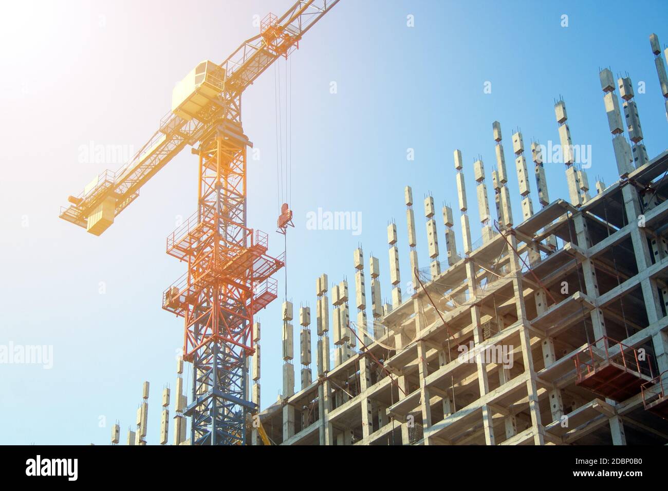 Construction crane in the process of building a new residential ...