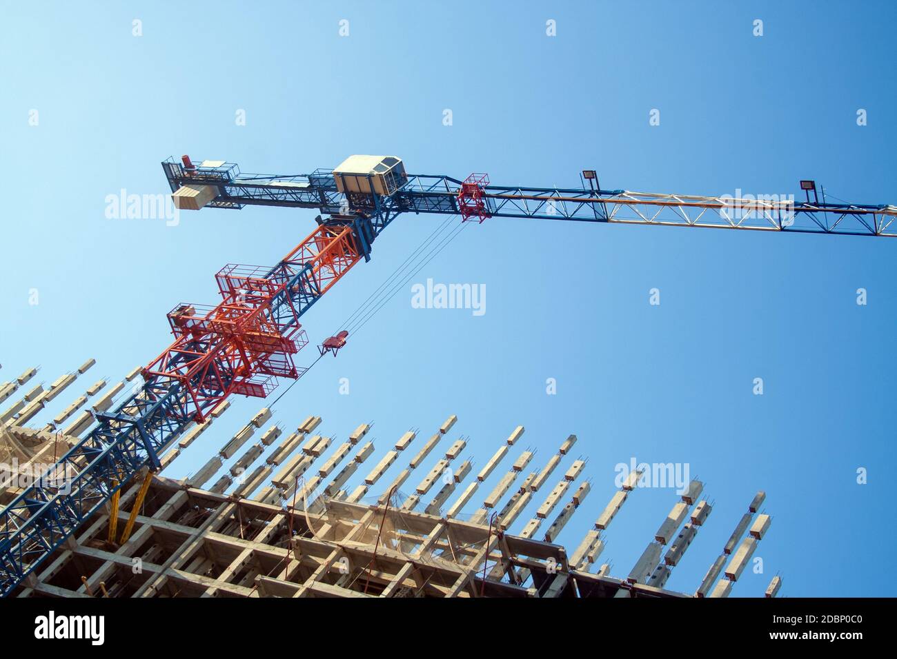 Construction crane in the process of building a new residential ...