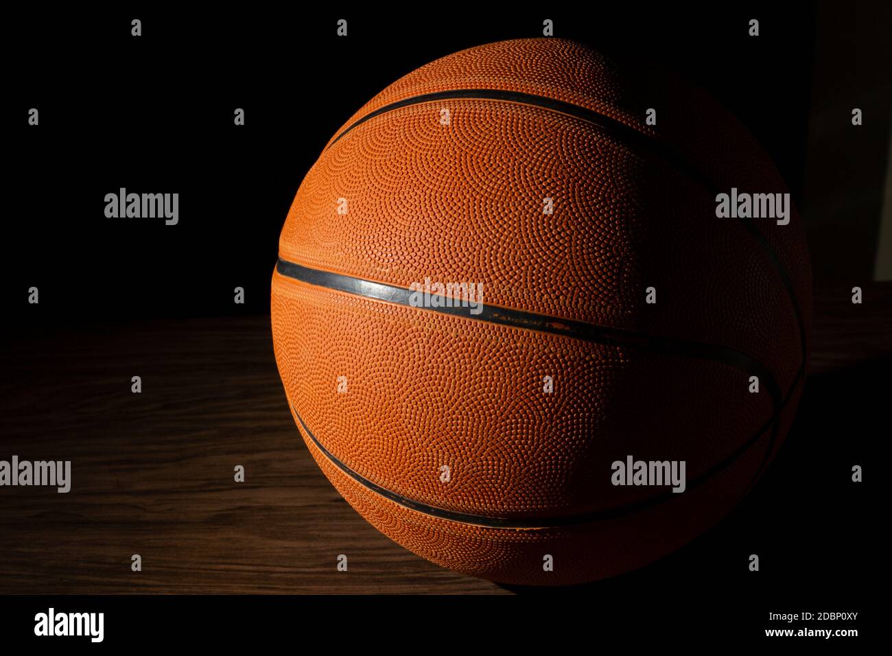 Basketball ball in a dark background Stock Photo - Alamy