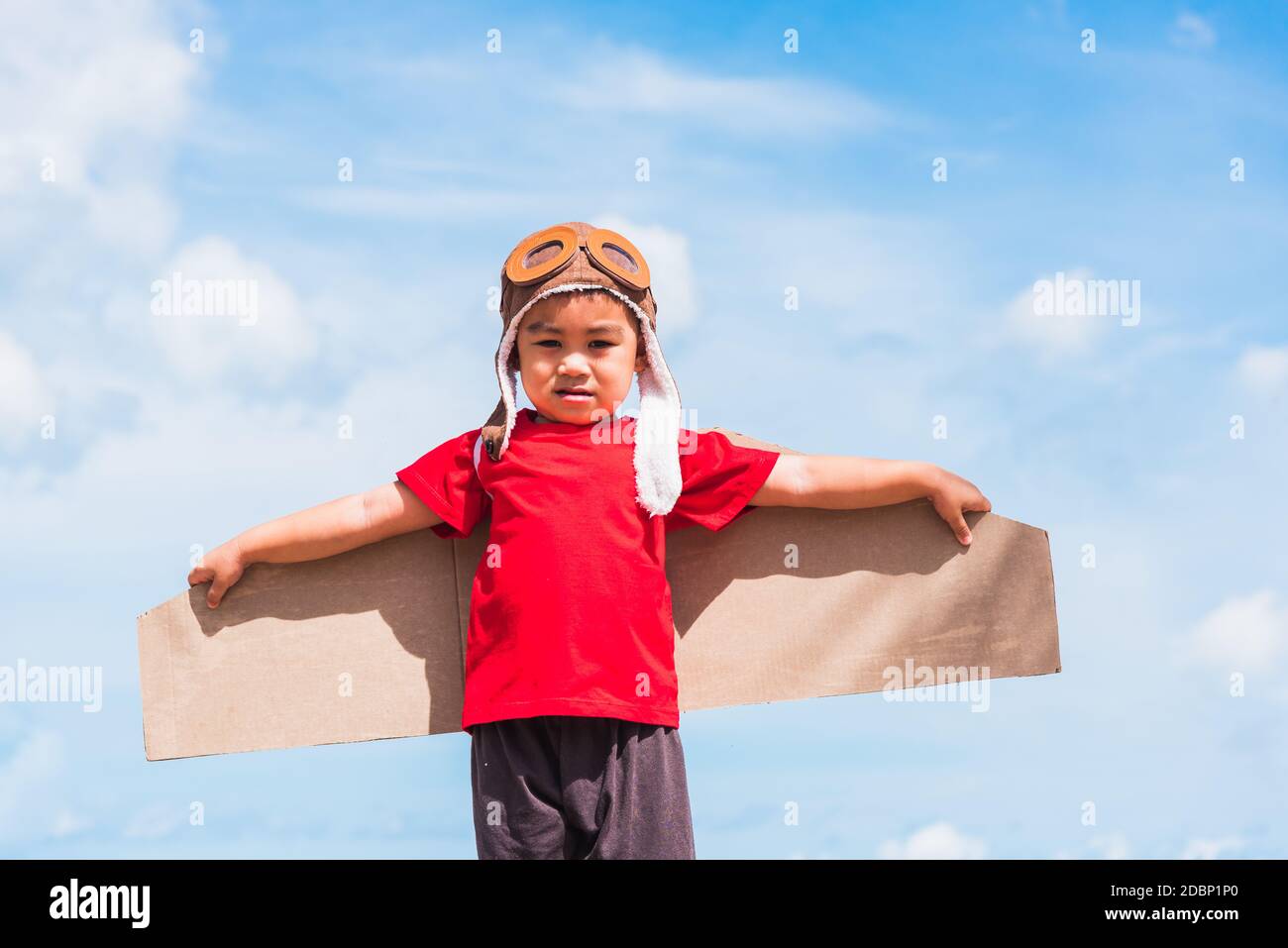 Happy Asian funny child or kid little boy smile wear pilot hat play and ...